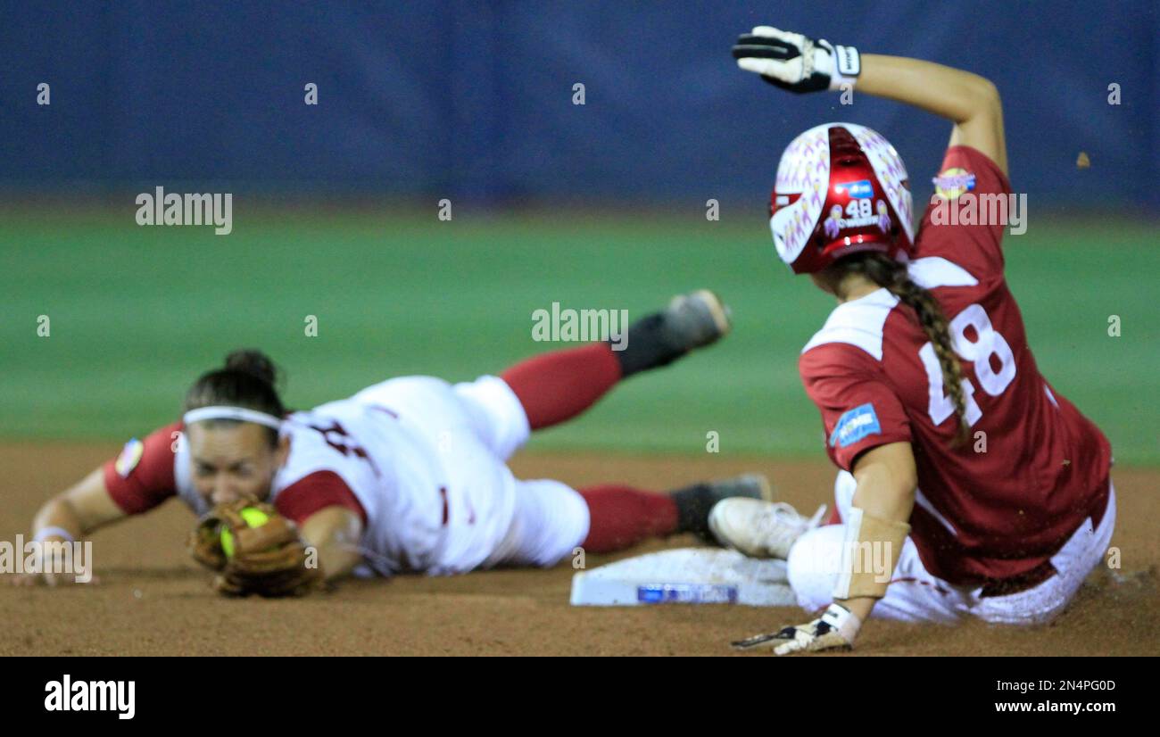 Oklahoma's Erin Miller slides into second base before Alabama second ...