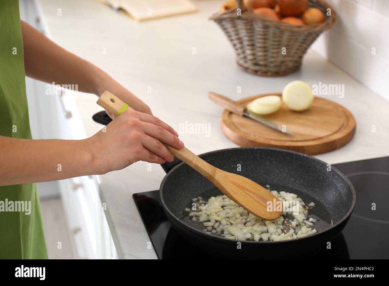 Frying chopped onion in hi-res stock photography and images - Alamy