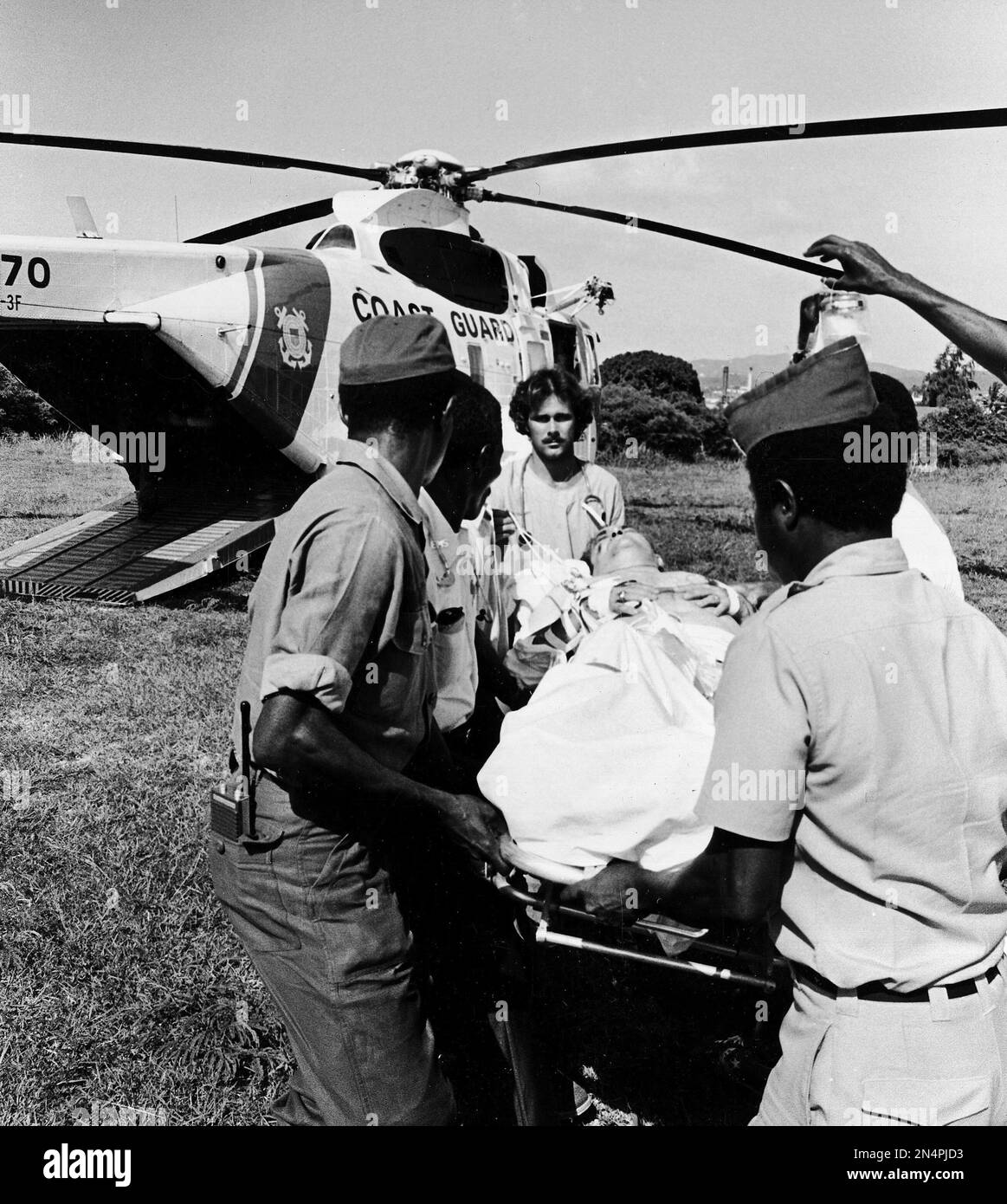 The Rev. Riley Fugitt of Clyde, Texas, is wheeled to a U.S. Coast Guard ...