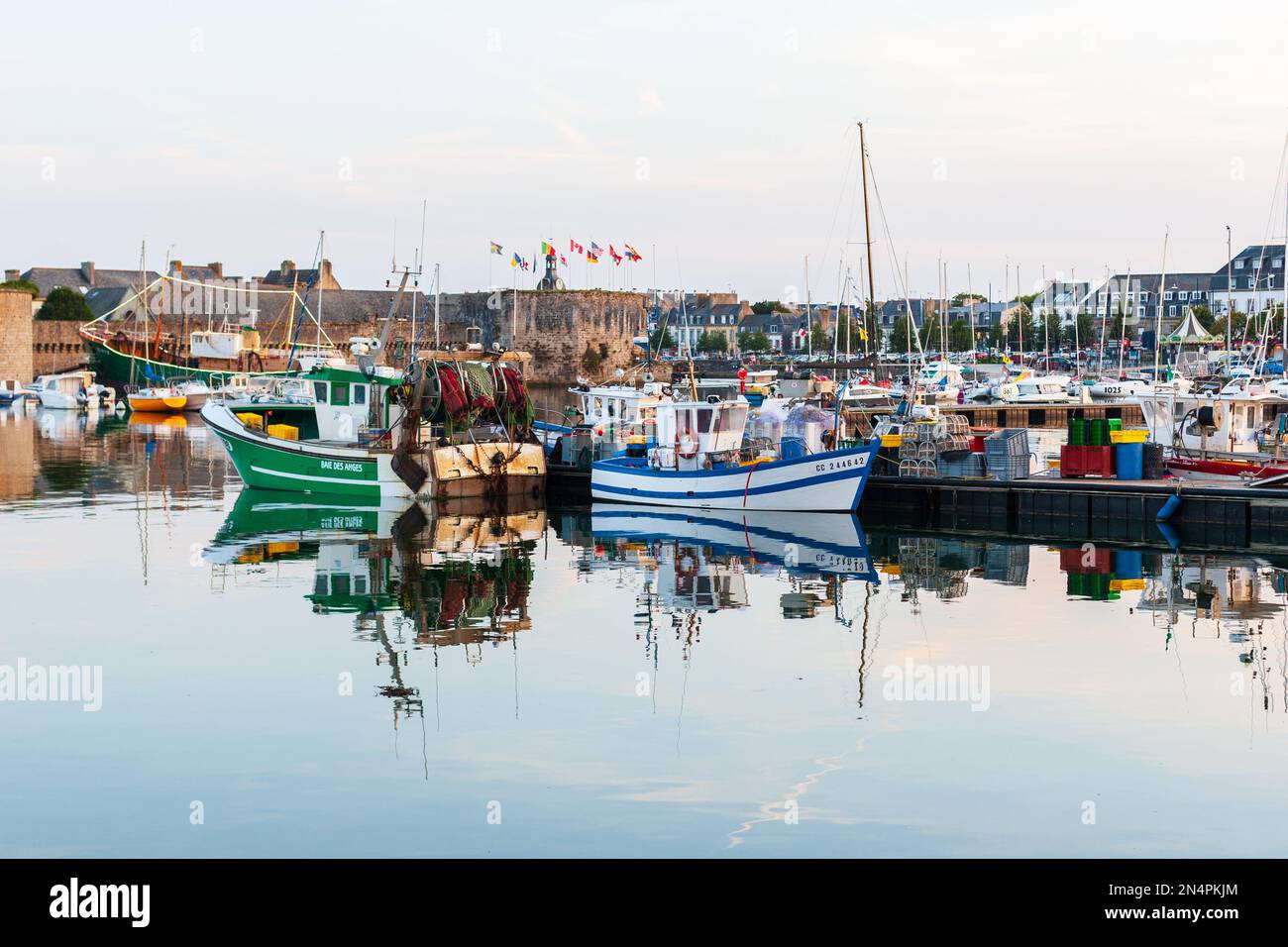A very crowded fishing harbour, with reflections Stock Photo - Alamy