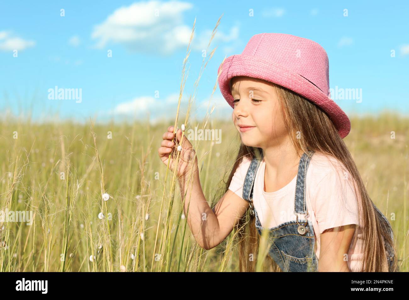 Cute little girl with spikes outdoors, space for text. Child spending ...