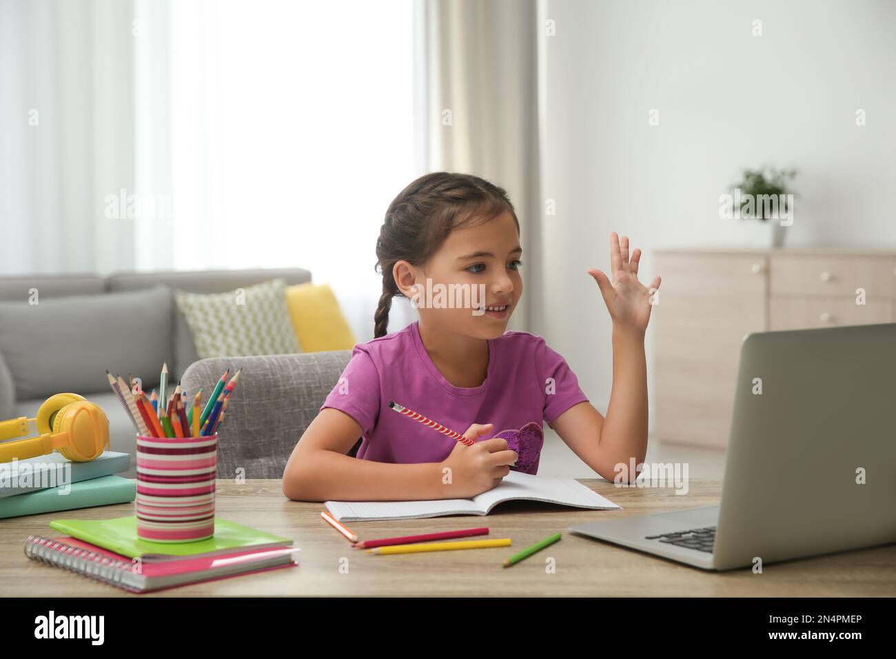 Distance learning, studying at home. Girl having online school lesson ...