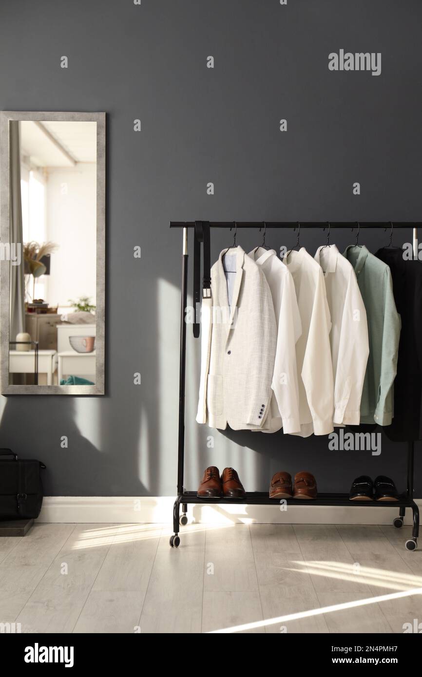 Dressing room interior with clothing rack and mirror Stock Photo - Alamy