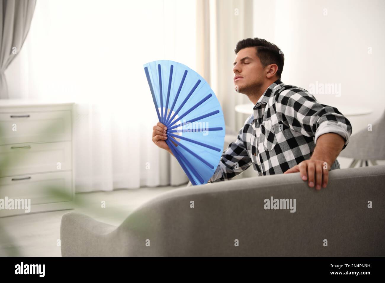 Man sitting on cooler hi-res stock photography and images - Alamy