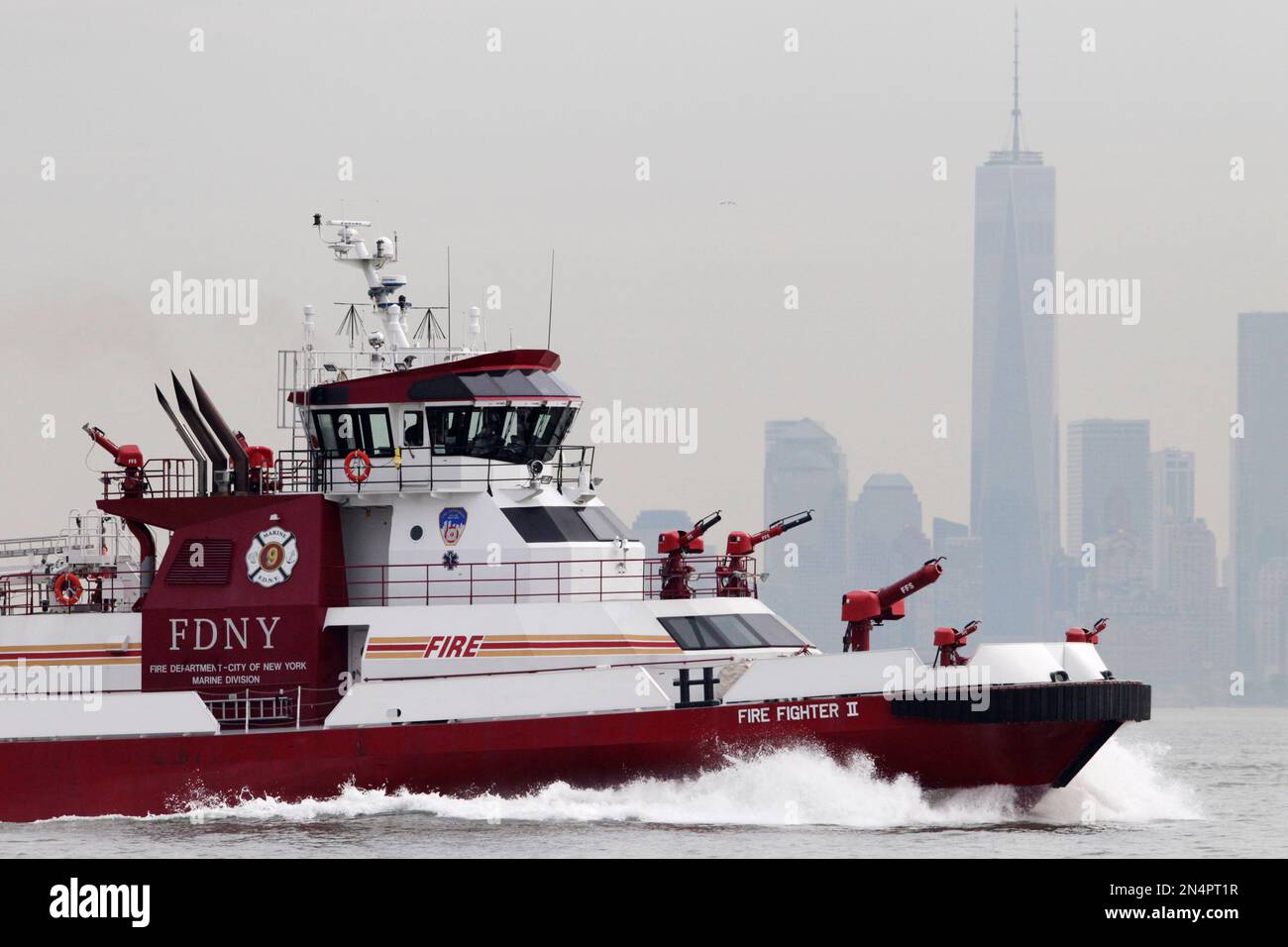 The New York City fireboat "Fire Fighter II" crosses New York Harbor ...