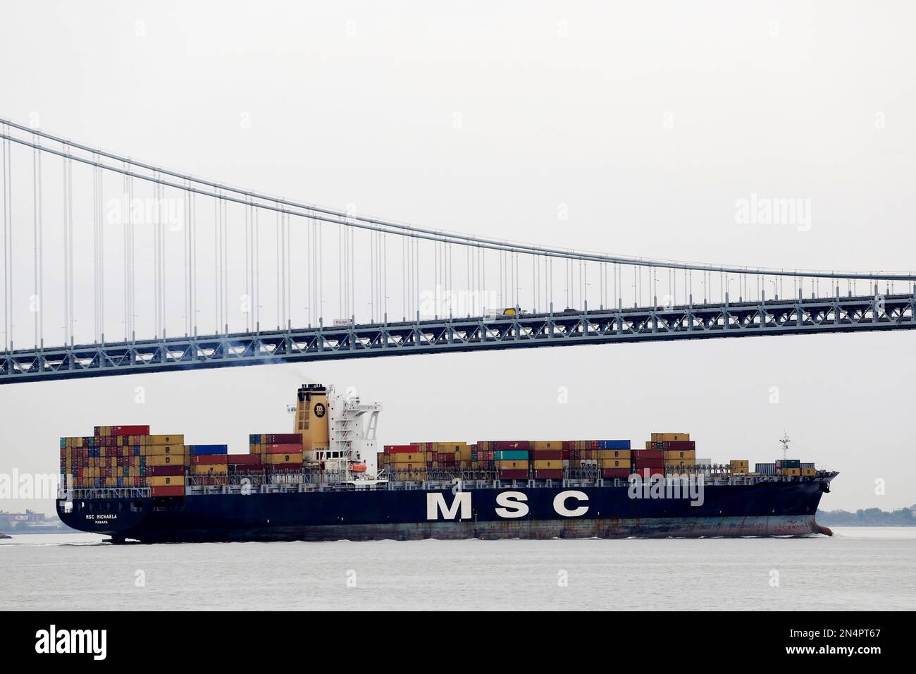 The container ship MSC Michaela leaves New York Harbor beneath the ...