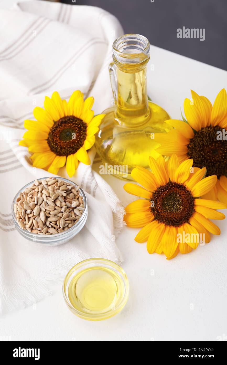 Composition with sunflower oil on white table, above view Stock Photo ...