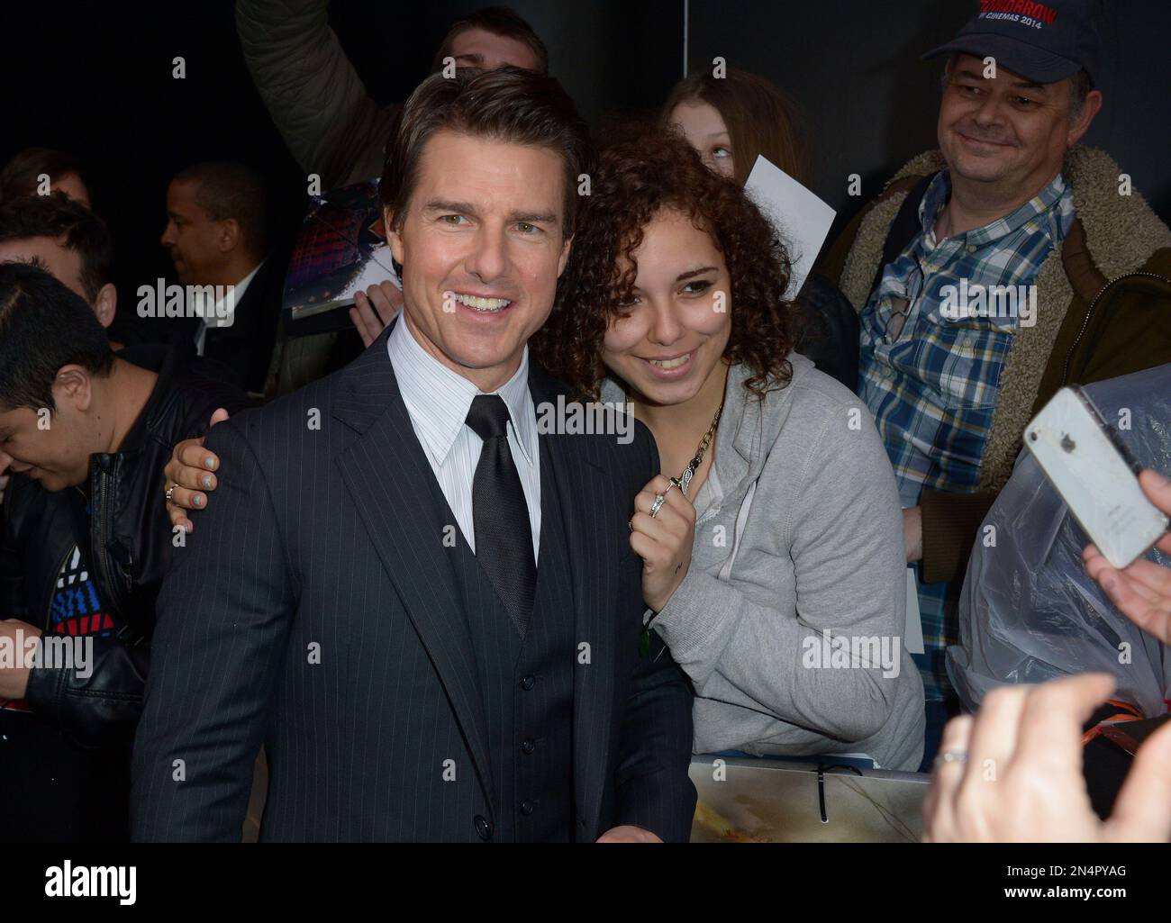 Tom Cruise poses for photographers at the Edge Of Tomorrow World ...