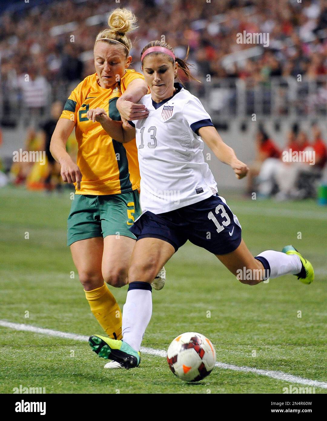 FILE - In this Oct. 20, 2013 file photo, USA forward Alex Morgan, right ...