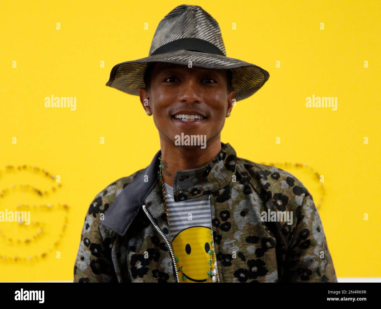 Singer Pharrell Williams poses during a news conference for the ...