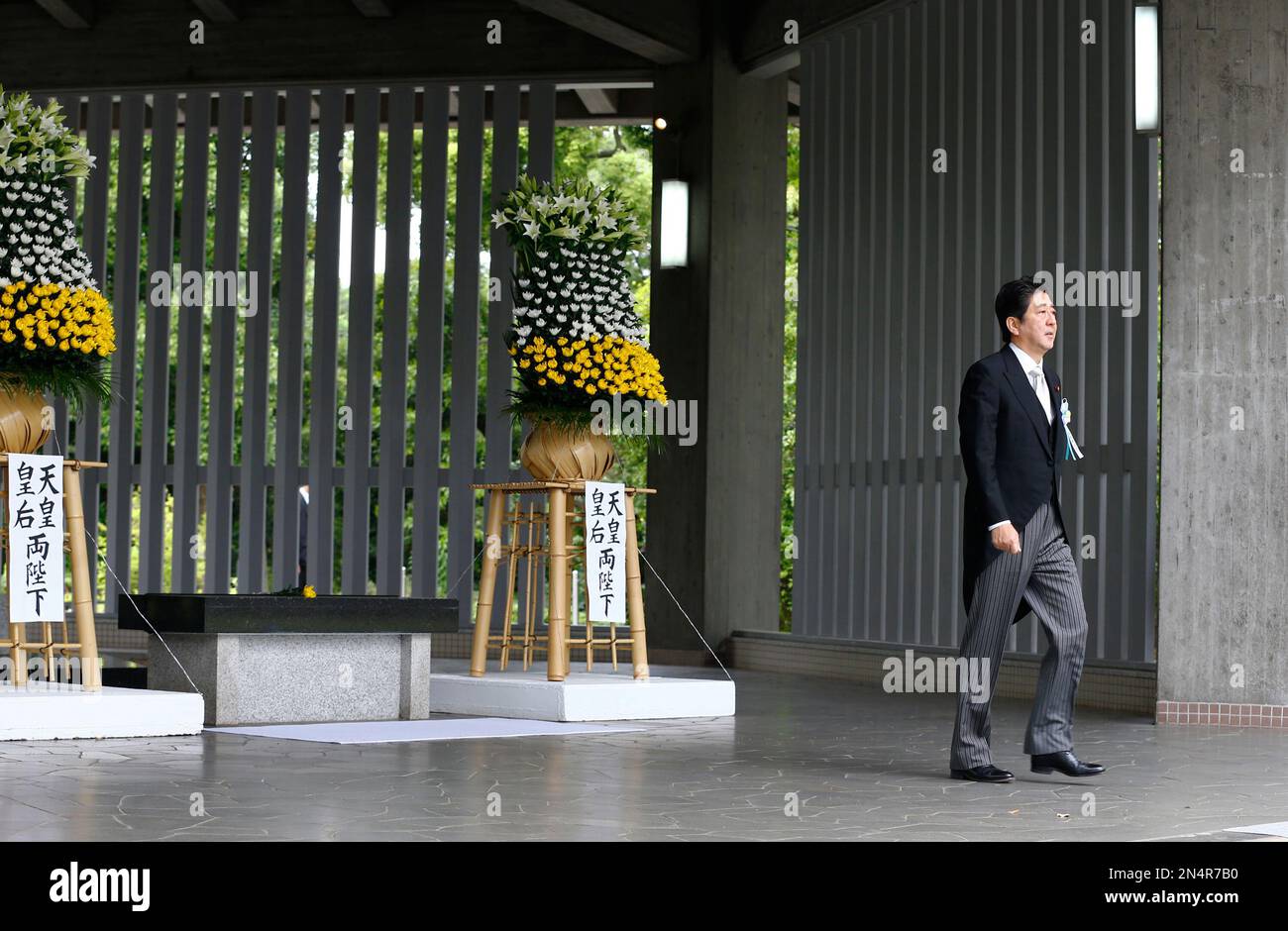 Japanese Prime Minister Shinzo Abe leaves after offering a prayer at ...