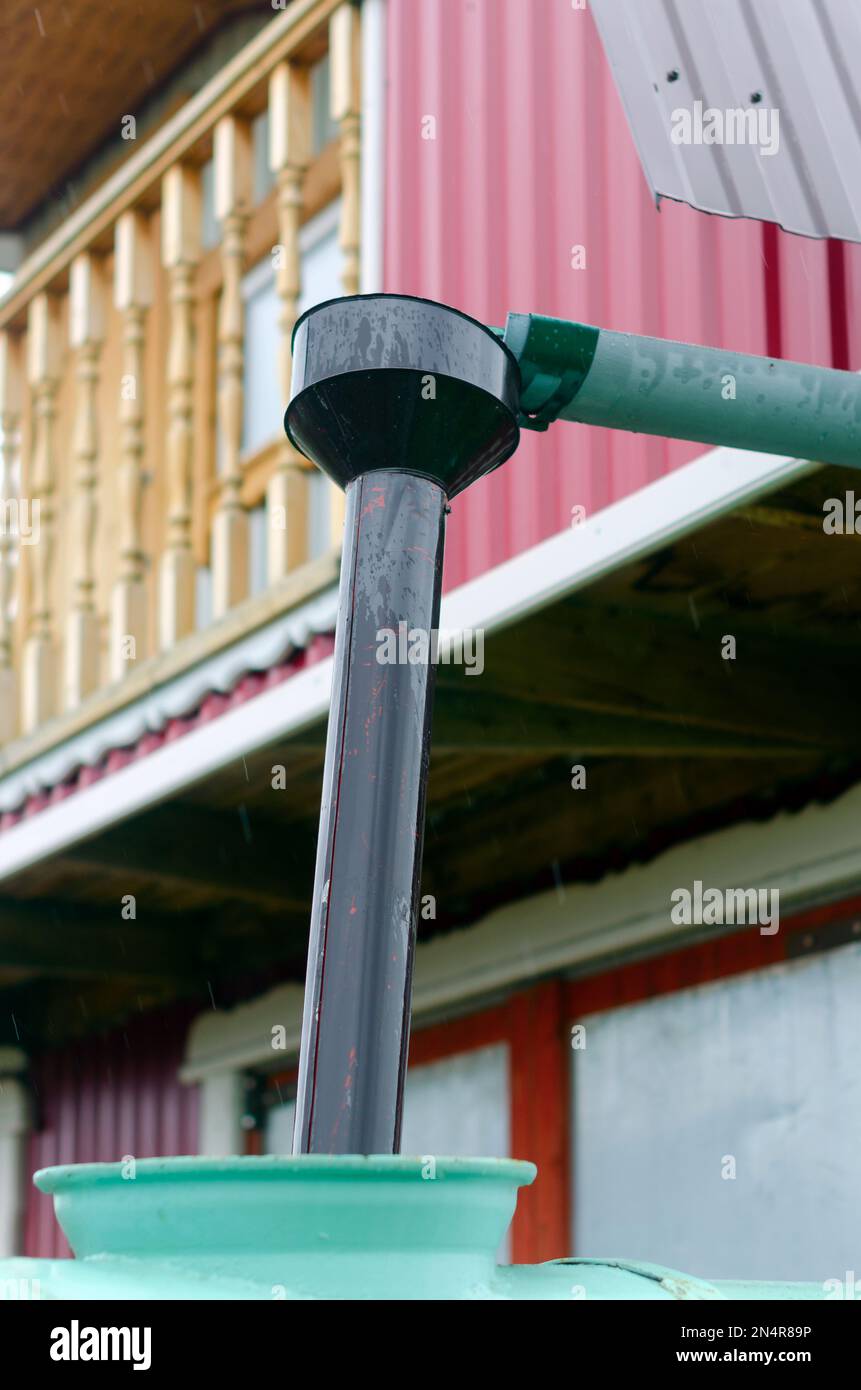 Water from the village roof flows into the gutter for drainage going ...