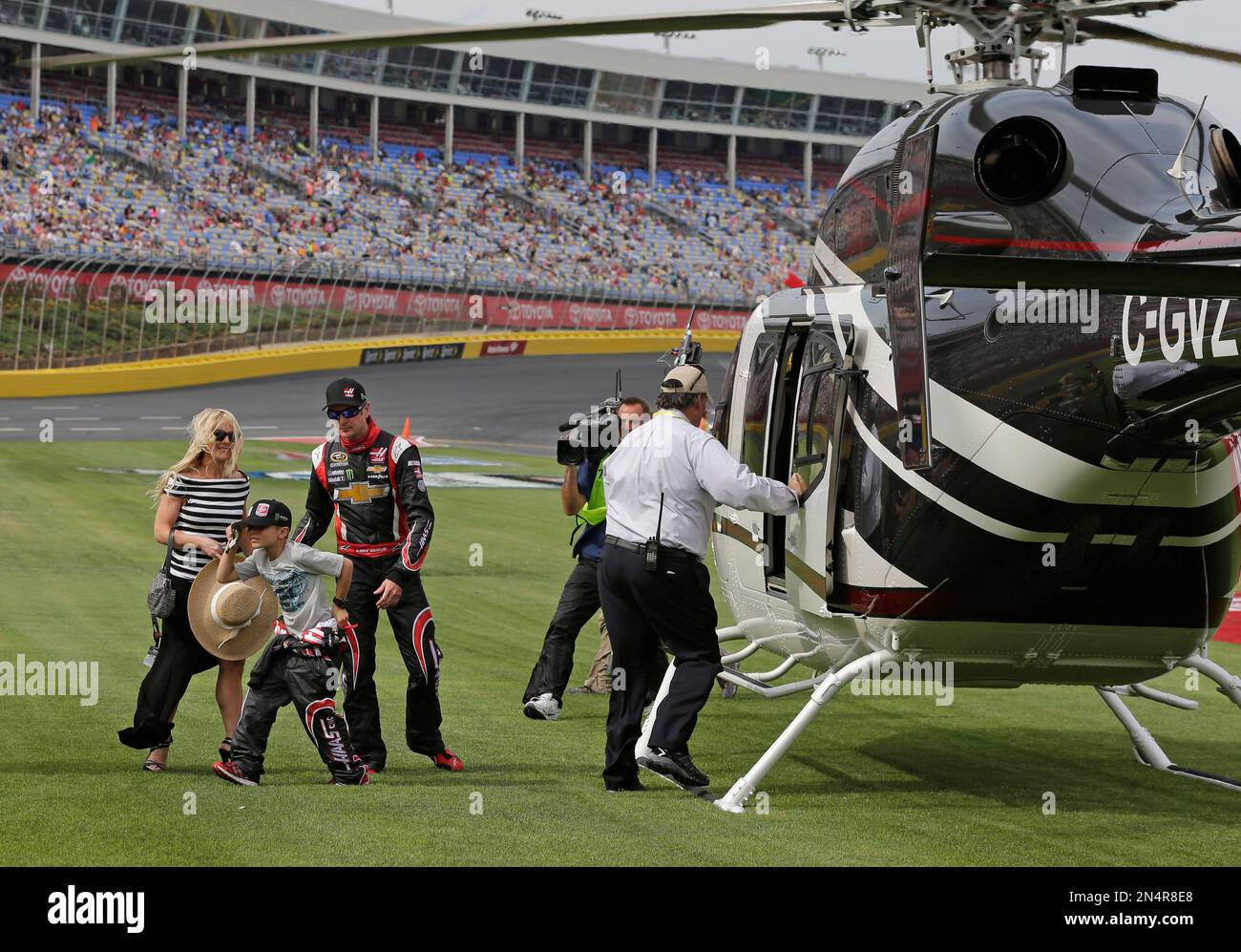 Kurt Busch, right, arrives with girlfriend Patricia Driscoll, left, and ...