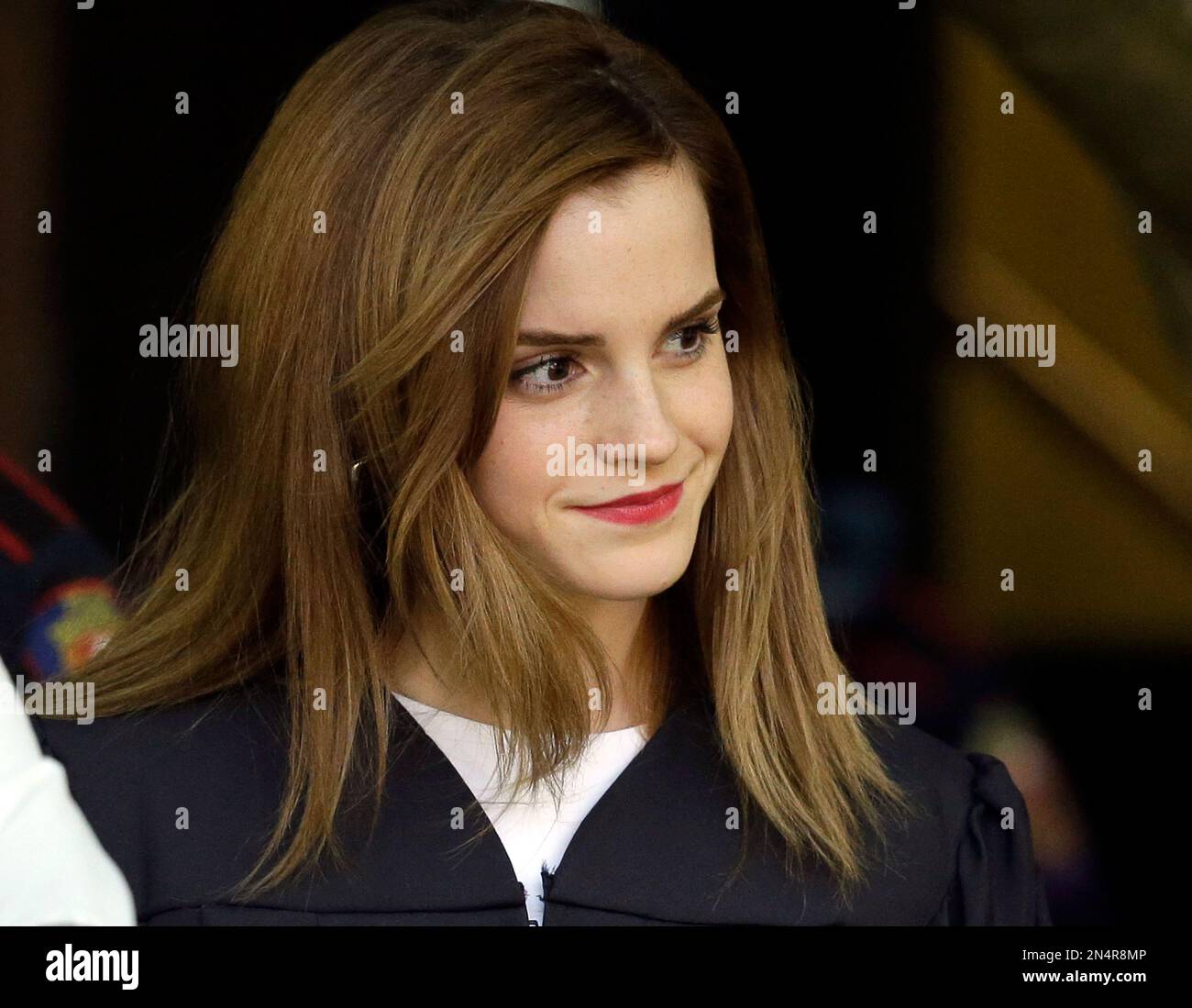 Actress Emma Watson walks between buildings following commencement ...