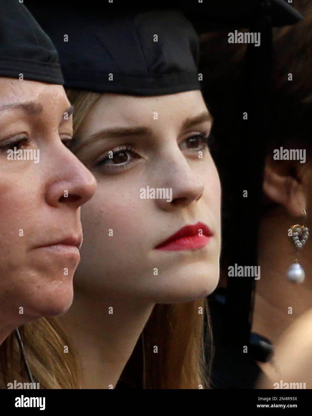 Actress Emma Watson, right, attends commencement services on the campus ...