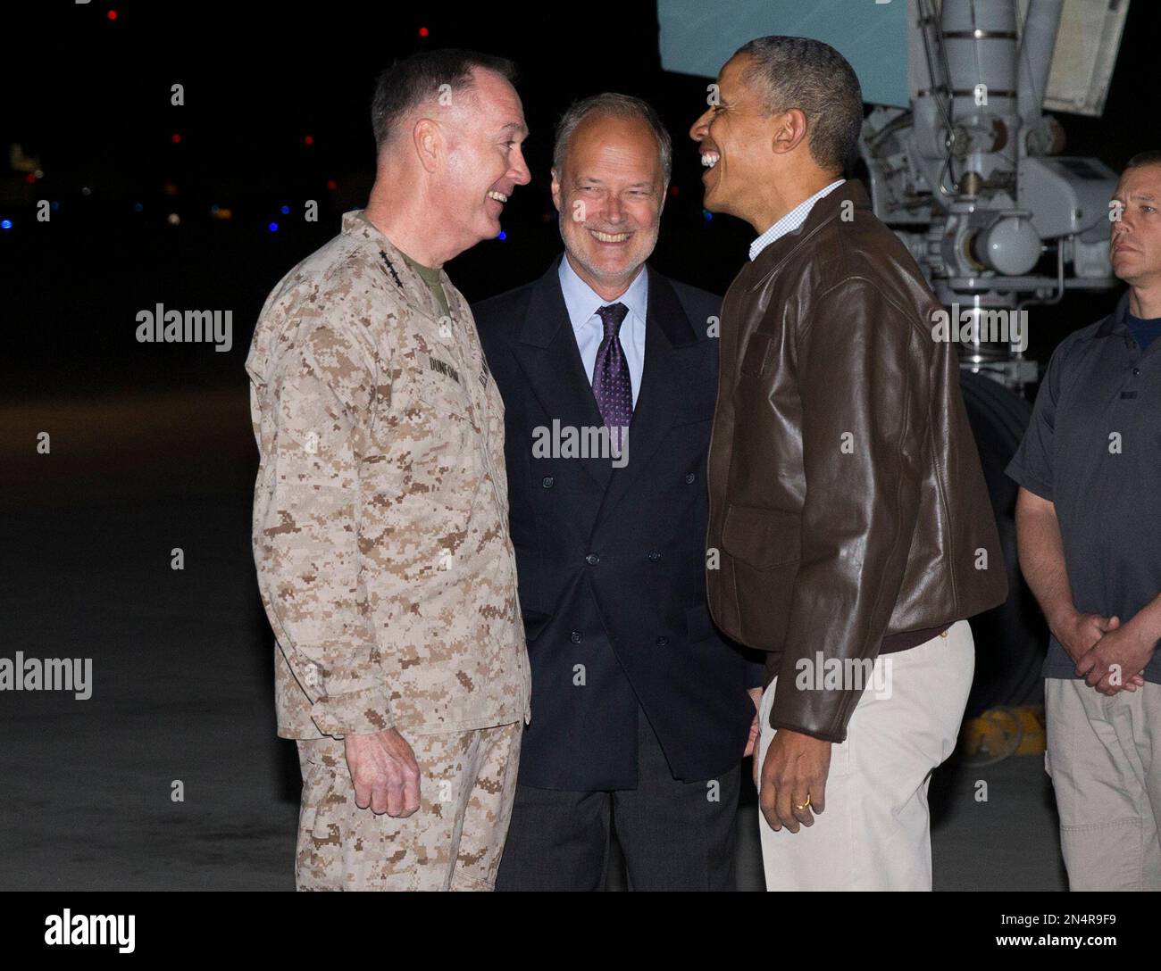 President Barack Obama, right, is greeted by US Ambassador to ...
