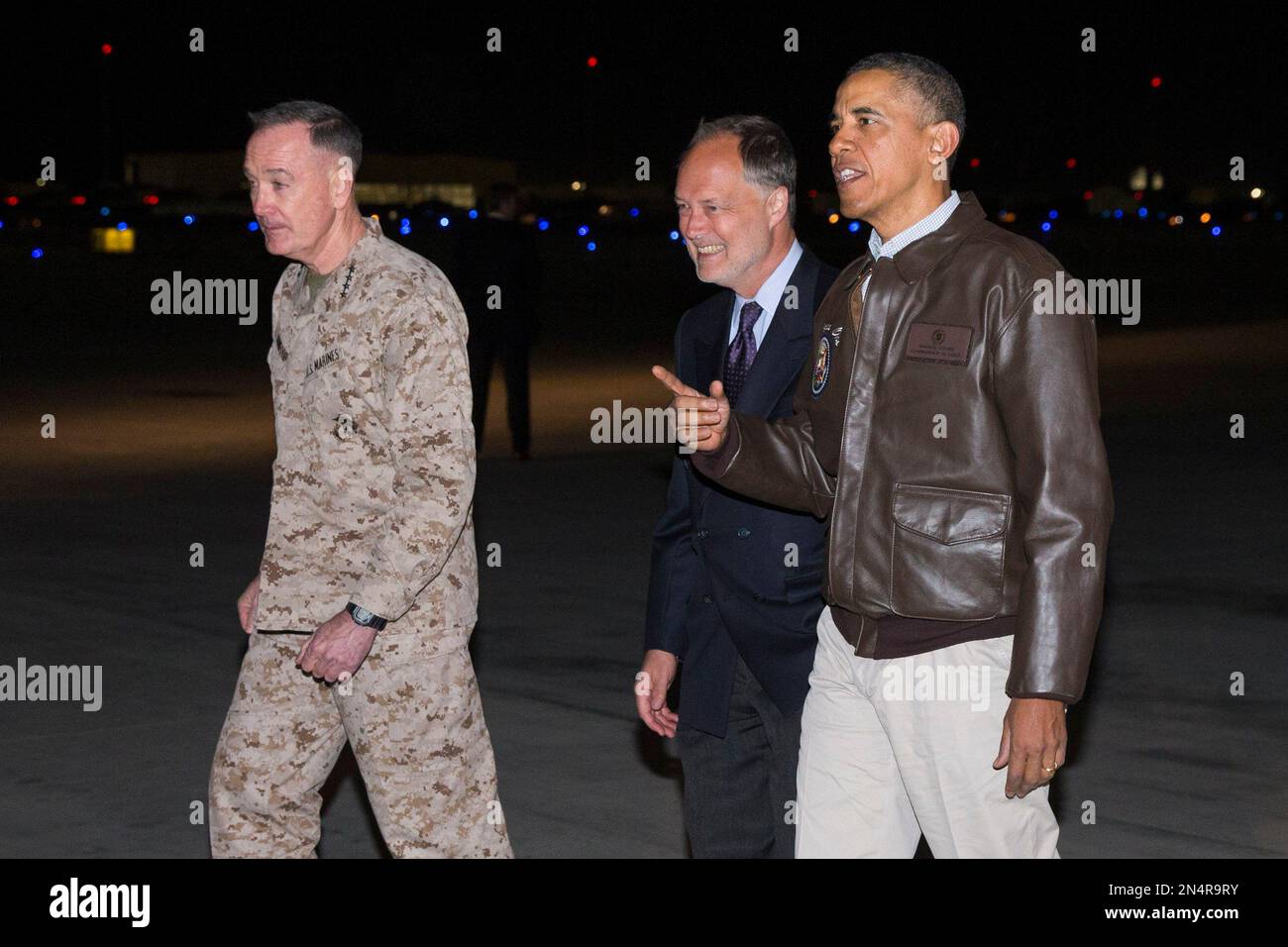 President Barack Obama, right, is greeted by US Ambassador to ...