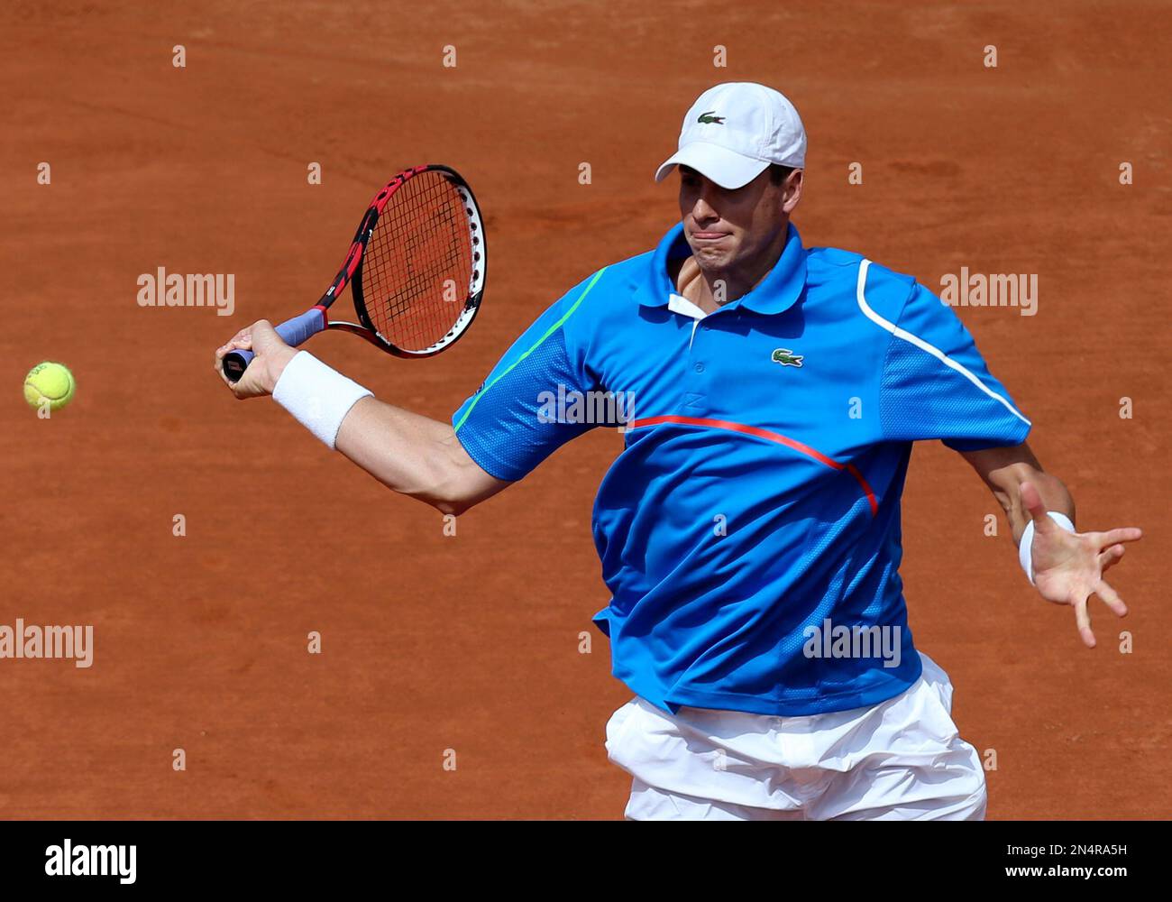 USA's John Isner returns the ball to France's Pierre-Hugues Herbert ...