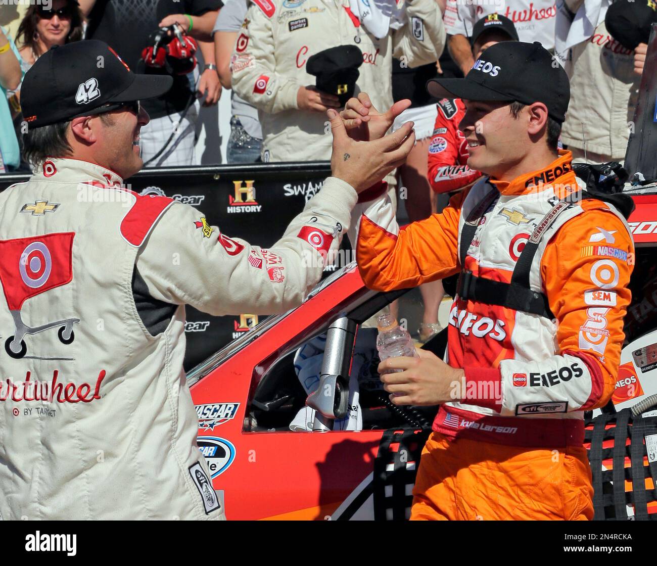 Kyle Larson, right, is congratulated by crew chief Scott Zipadelli ...