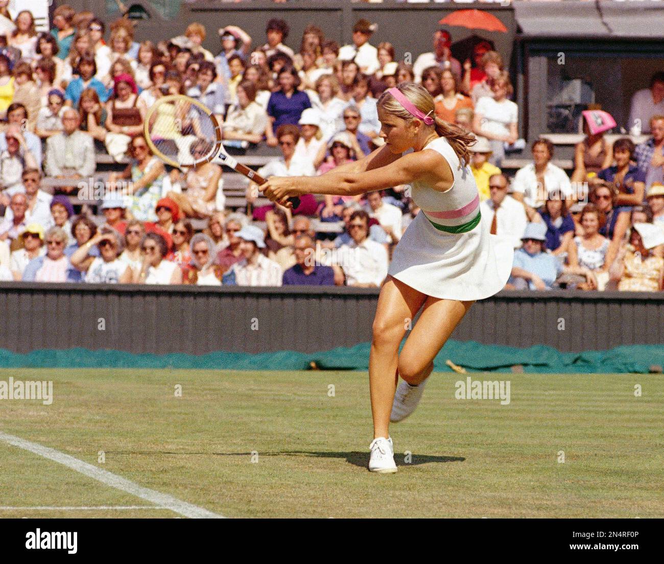 FILE - This is a 1975 file photo showing Chris Evert playing tennis. Evert won the first of her ...