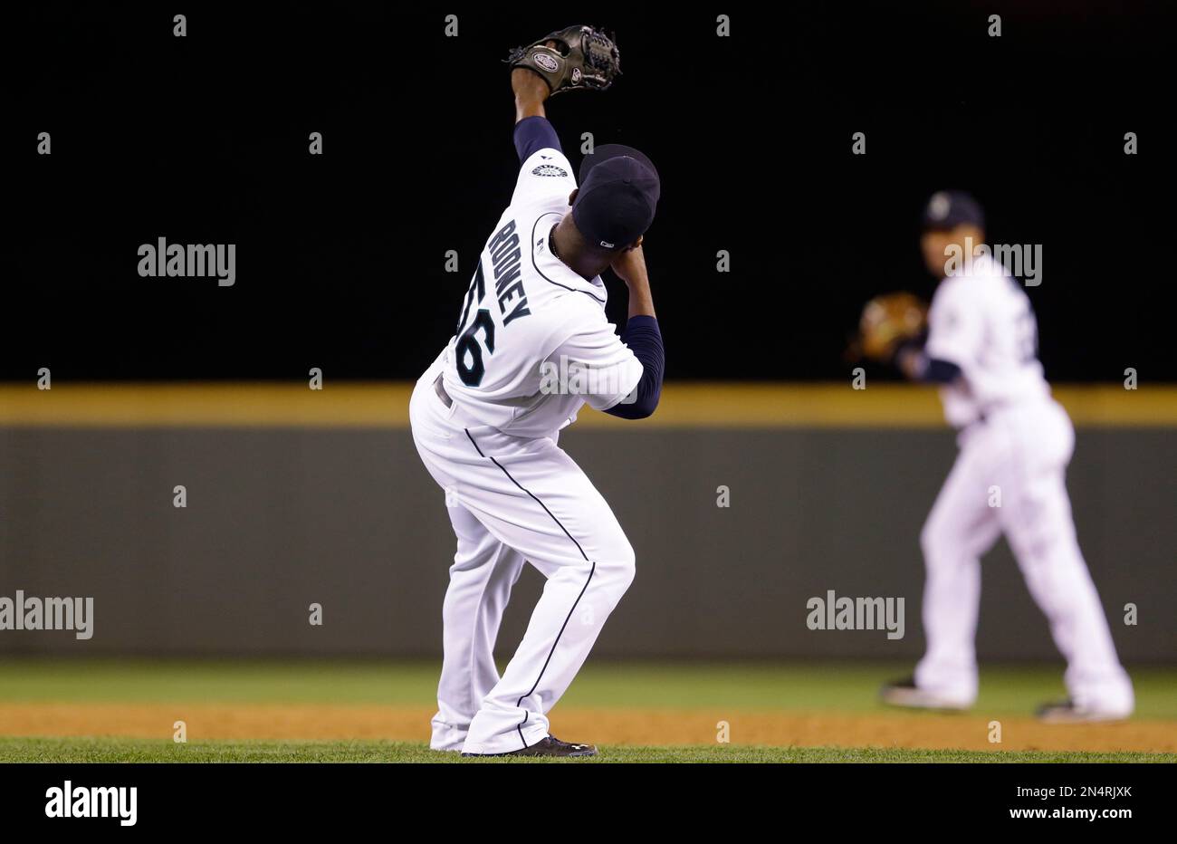 Seattle Mariners relief pitcher Fernando Rodney, left, strikes his ...