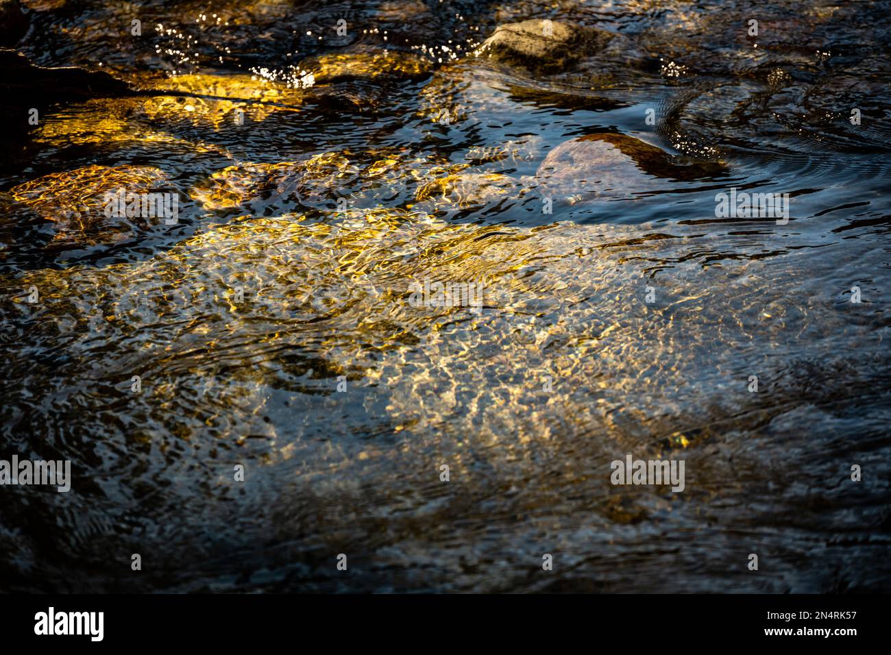 Deep Water Ripples Over Dark Rocks Below in Kings Canyon Stock Photo ...