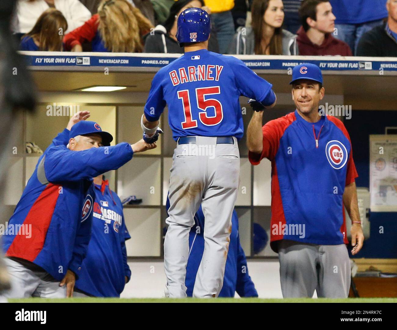 Chicago Cubs' Darwin Barney is congratulated by manager Rick Renteria ...