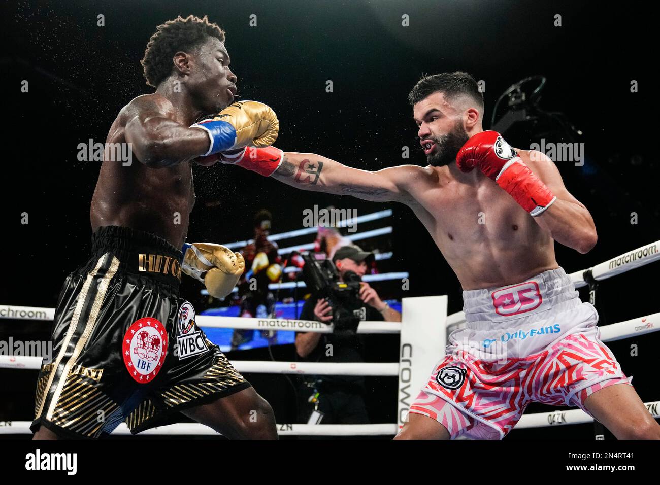 Richardson Hitchins, left, fights John Bauza during the fourth round of ...