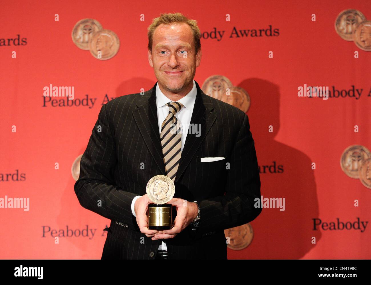 Danish screenwriter and television chef Adam Price poses with his award ...
