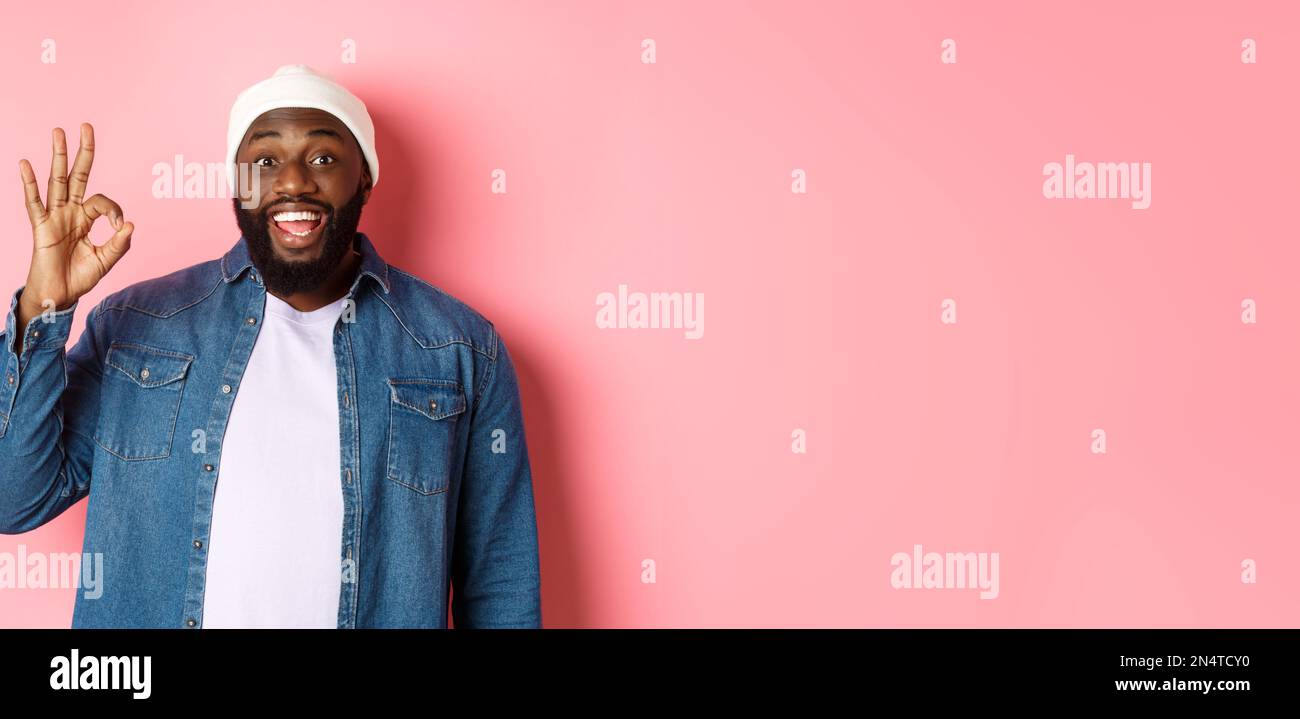 Happy smiling Black guy showing okay sign, approve and praise good ...
