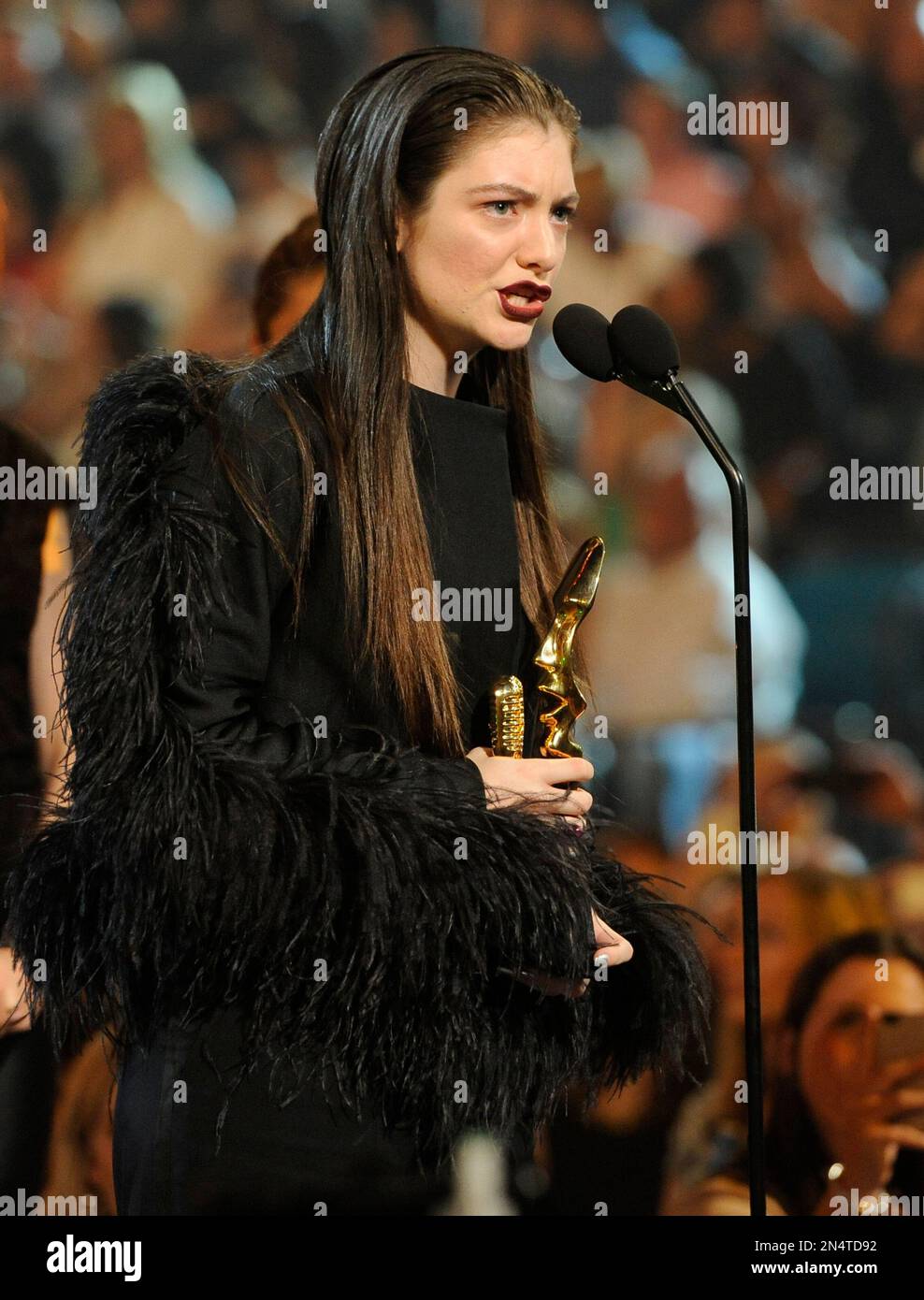 Lorde accepts the award for top rock song for “Royals” at the Billboard ...
