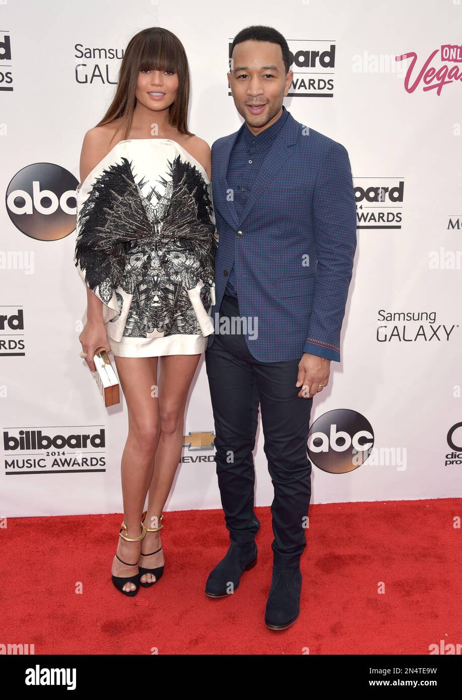 Chrissy Teigen, left, and John Legend arrive at the Billboard Music ...