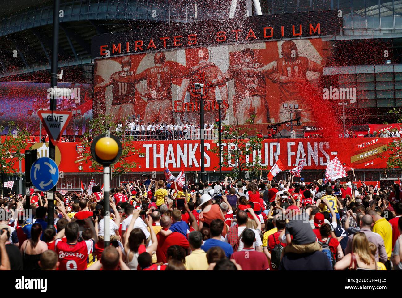 Arsenal's players show off their trophy to the supporters outside the ...