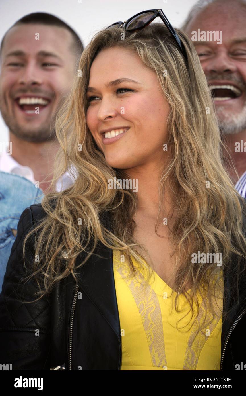 Glen Powell, Ronda Rousey and Kelsey Grammer during a photo call for ...