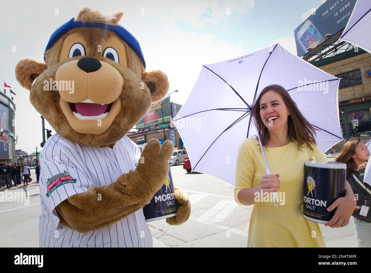 Clark, the Cubs new mascot, with a Morton Salt Girl outside Wrigley ...