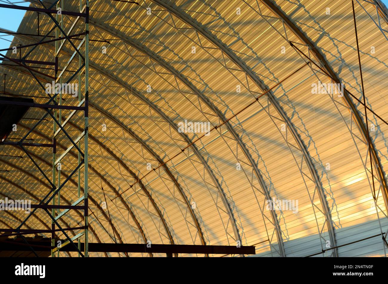 The construction of the roof of the new hangar in a semi-circle of ...