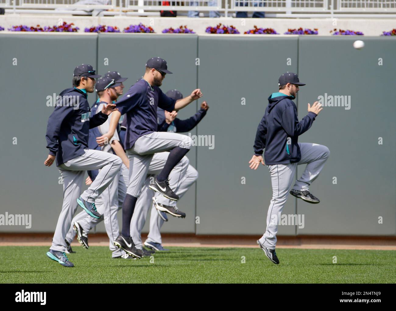 Seattle Mariners players warm up before a baseball game against the ...
