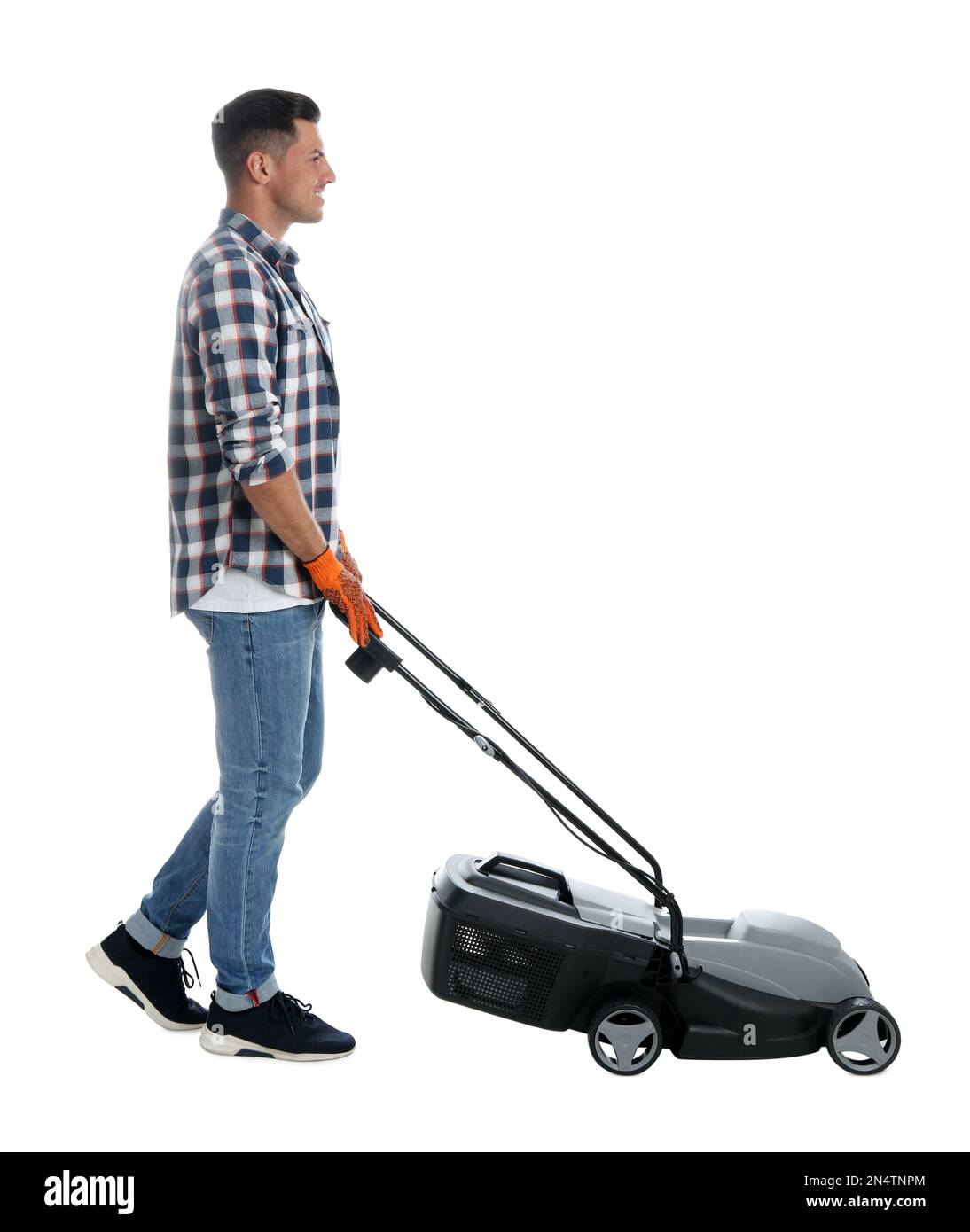 Man using lawnmower on garden hi-res stock photography and images - Alamy