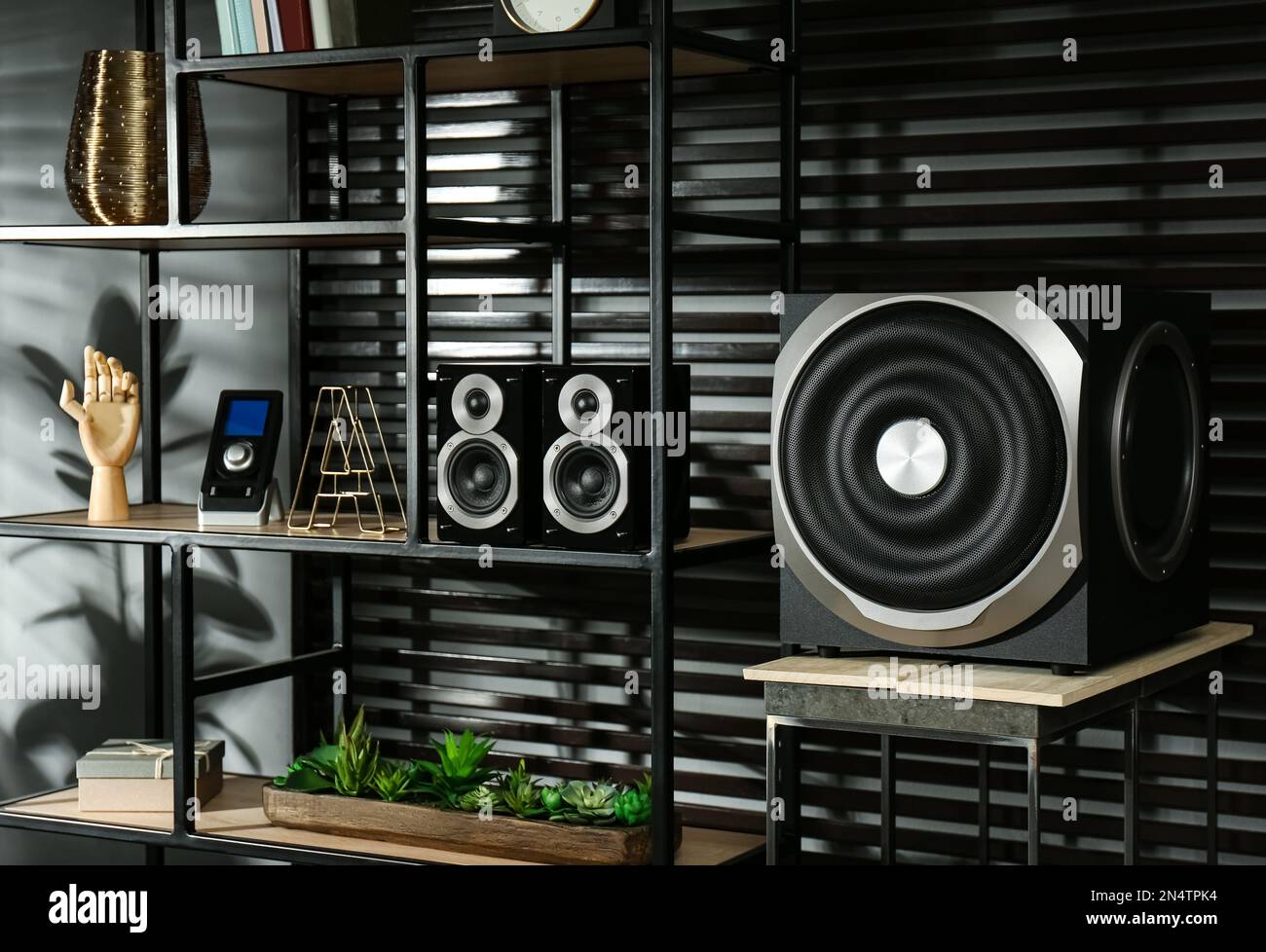 Modern audio speaker system on shelving indoors Stock Photo - Alamy