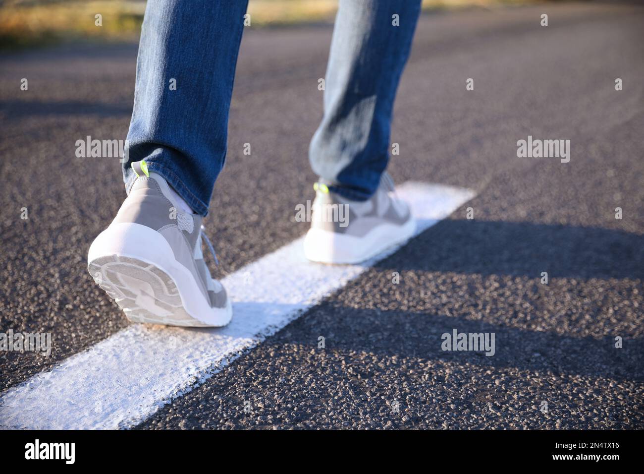 Male legs walking along road hi-res stock photography and images - Alamy