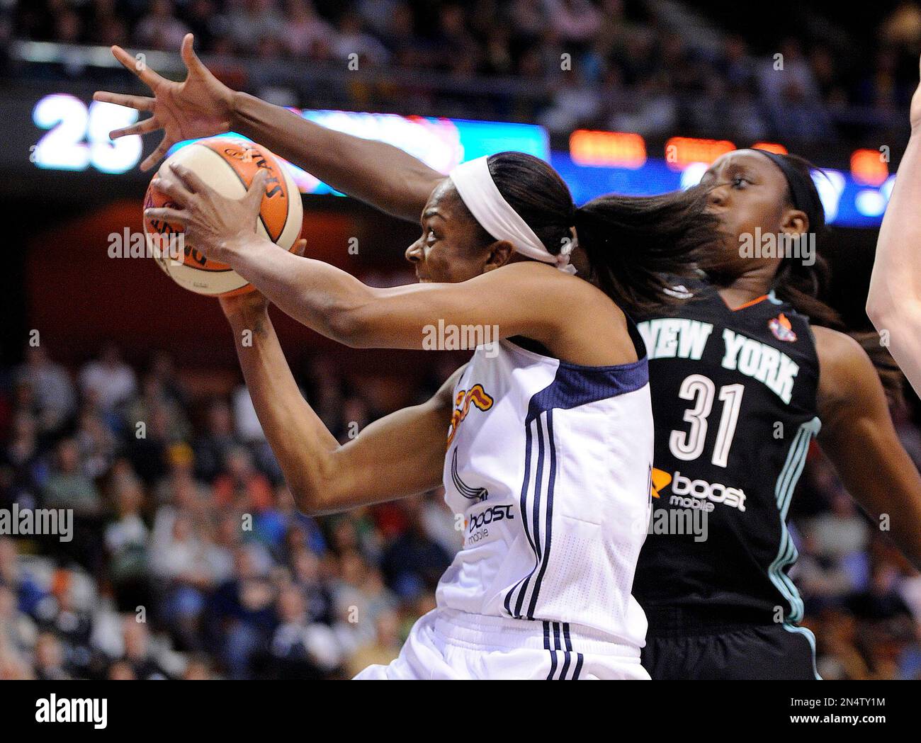 New York Liberty's Tina Charles, right, guards Connecticut Sun's ...