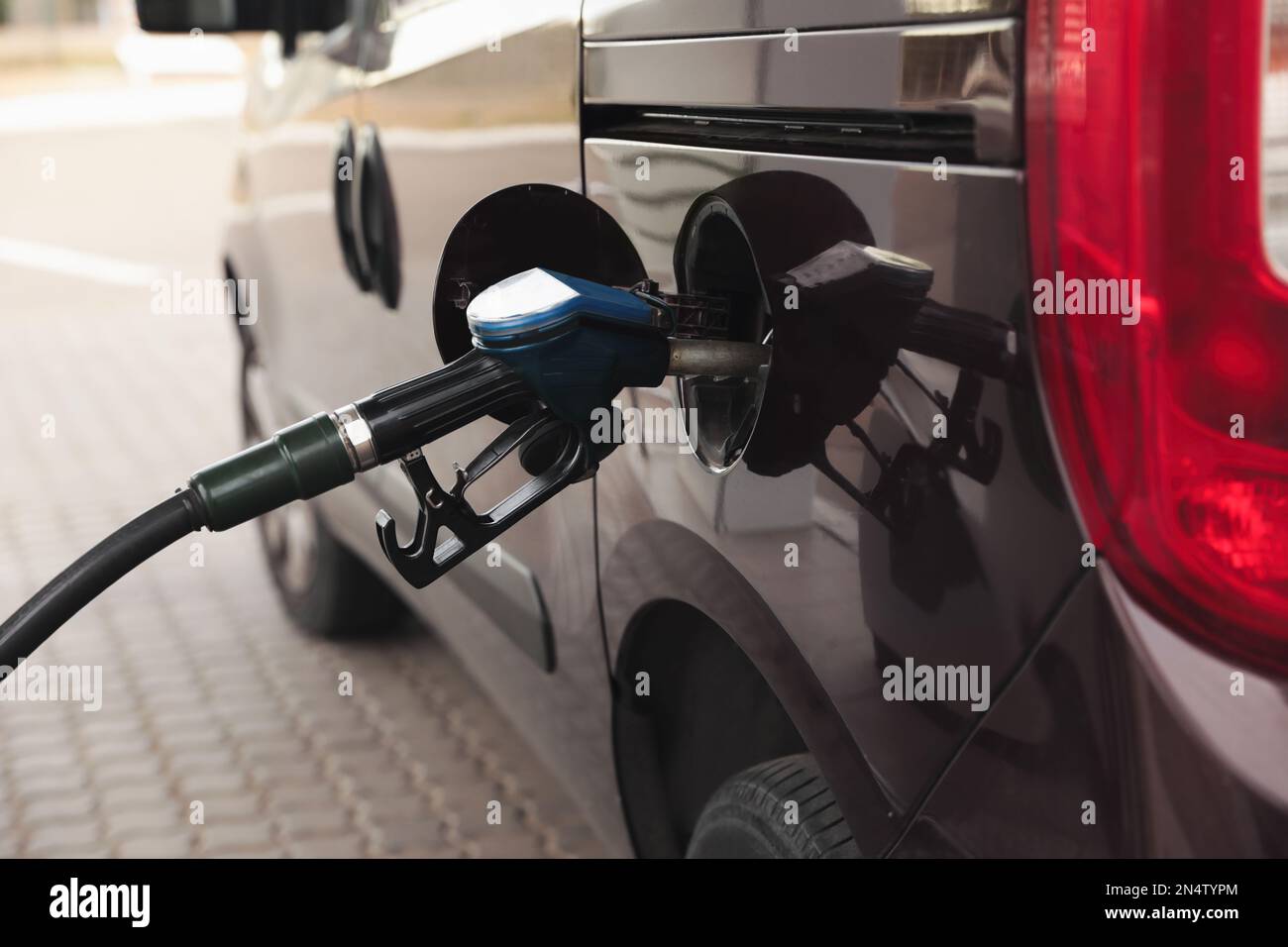 Refueling modern car at gas filling station, closeup Stock Photo - Alamy
