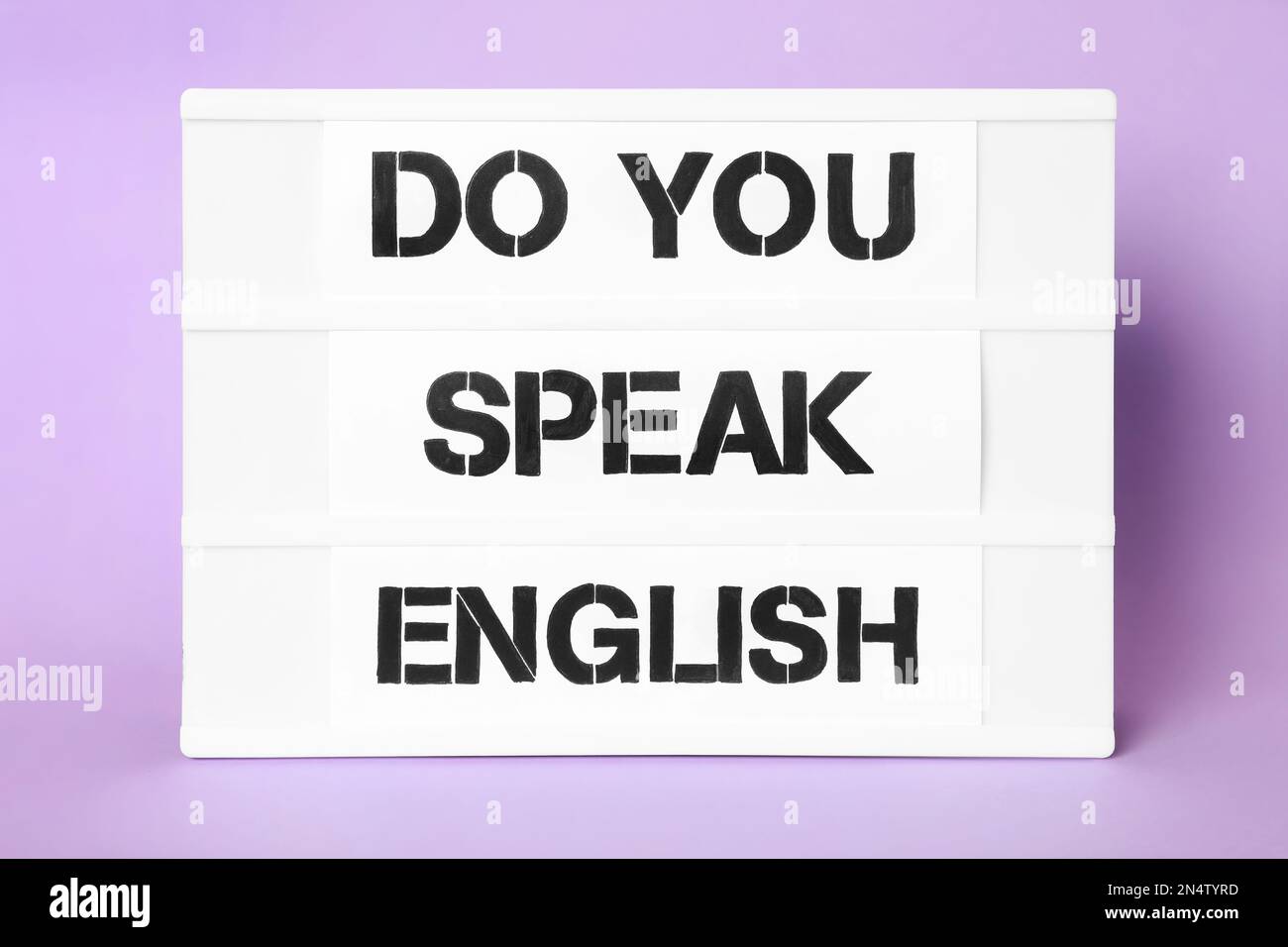 Stand with question Do You Speak English on violet background Stock ...