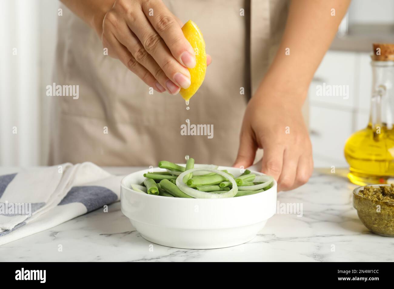 Woman adding green onion delicious hi-res stock photography and images ...