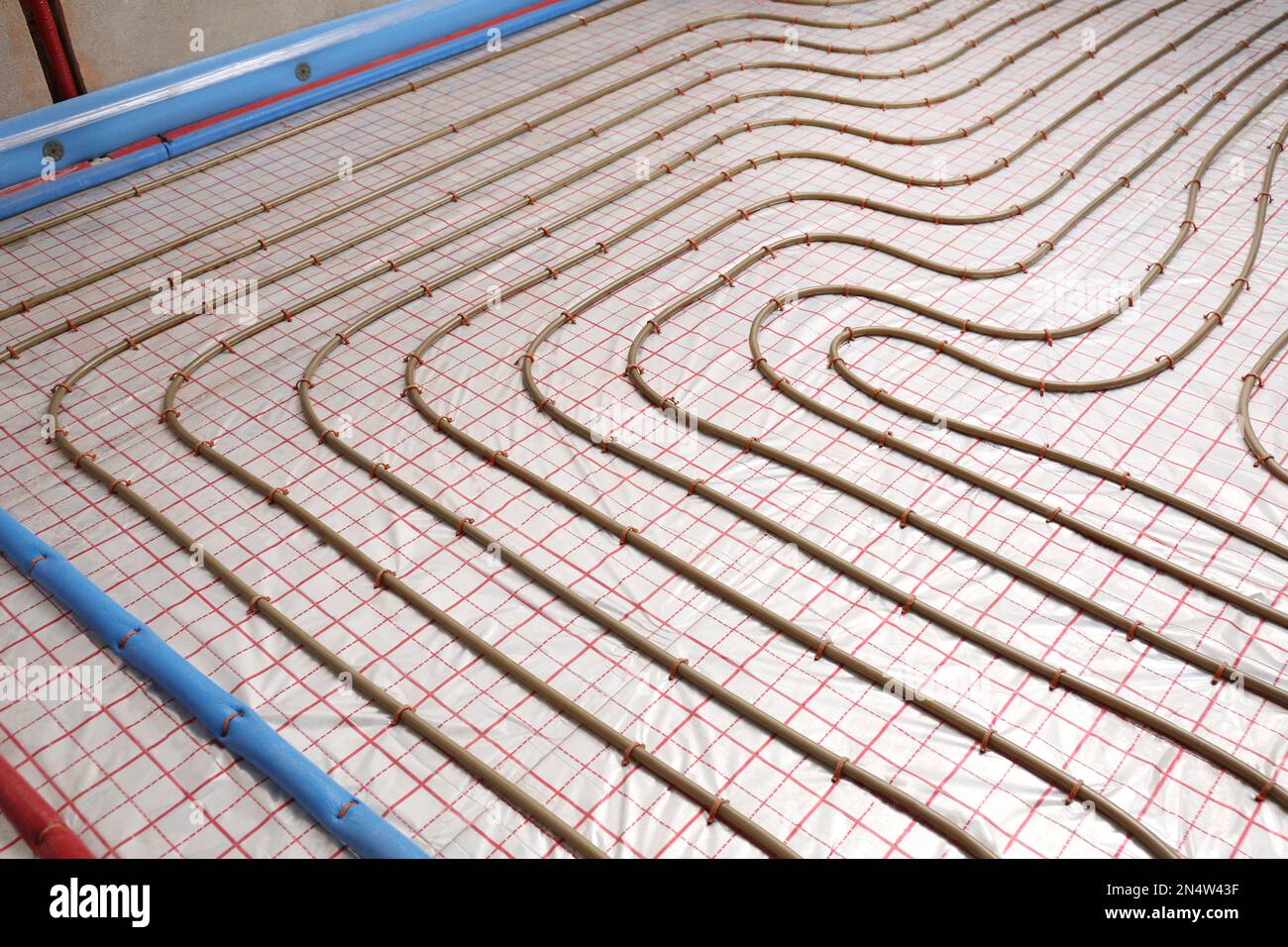 Installation of underfloor heating system in building Stock Photo - Alamy