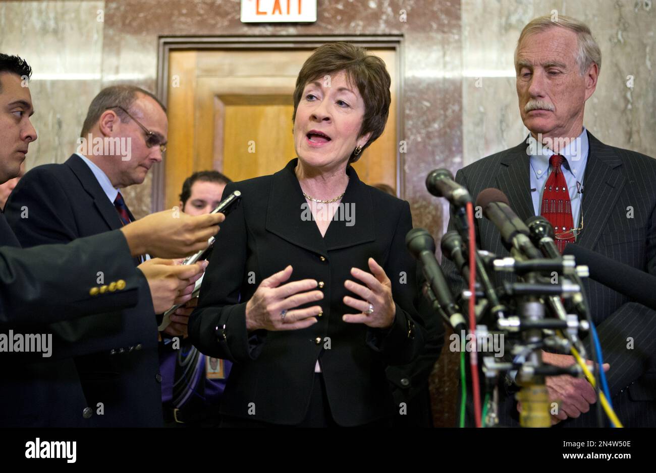 FILE - Following a meeting with Sen.-elect Angus King of Maine, right ...