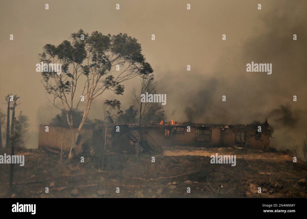 A mountain top home burns in the Cocos fire Thursday, May 15, 2014, in ...