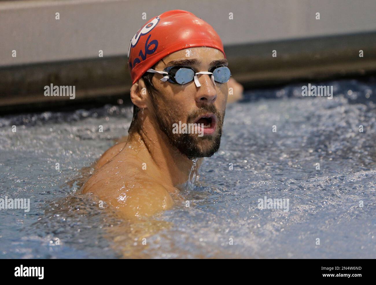 Michael Phelps looks to his coach during warms up before the upcoming ...