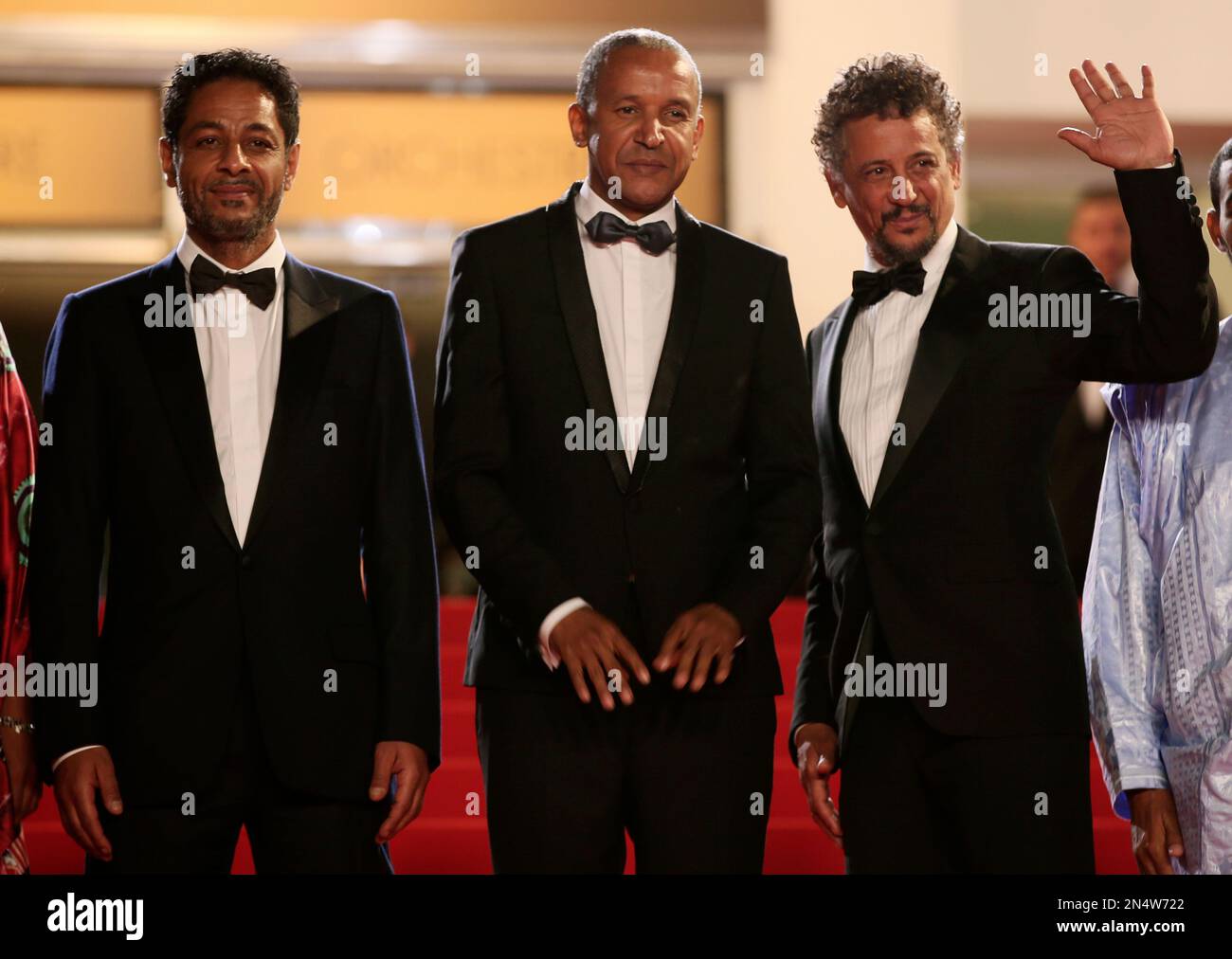 From left, actor Hitchem Yacoubi, director Abderrahmane Sissako and ...
