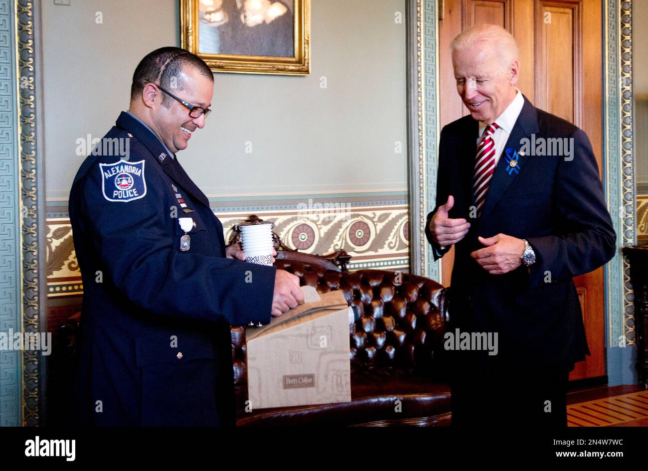 Vice President Joe Biden is presented with a container of coffee by ...